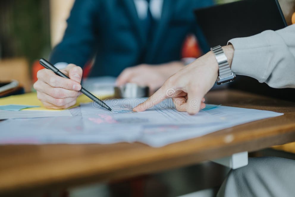 Close-up of Teamwork during Decision Making with Focus on Documents and ...