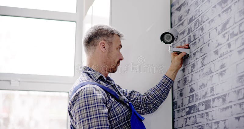 Close-up of Technician Adjusting CCTV Camera Stock Photo - Image of ...