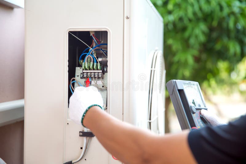 Close Up Technician Hand Using Meter is Measuring Equipment To Checking ... Close Up Technician Hand Using Meter is Measuring Equipment To Checking ...