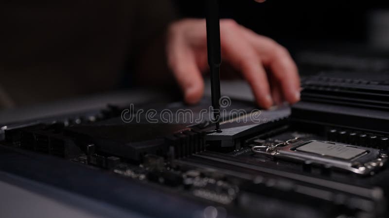 Close-up of Technicians Hands Unscrewing Cover on Computer Motherboard ...
