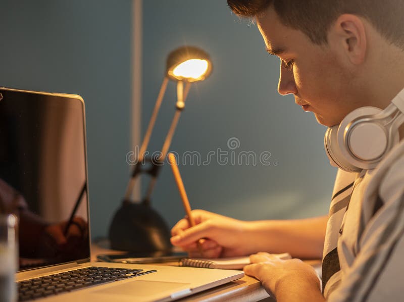 Close-up of Teen Taking Notes in a Diary at His Desk Stock Photo ...
