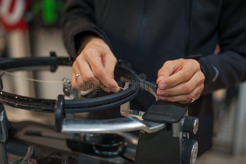 Close Up of Tennis Stringer Hands Doing Racket Stringing Stock Photo ...