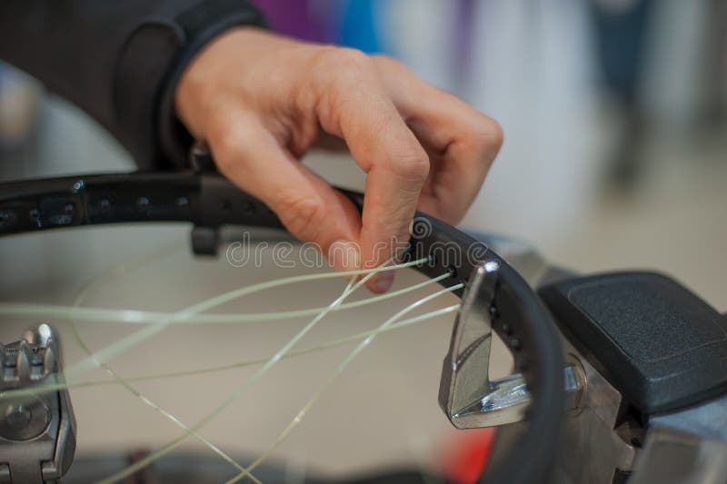 Close Up of Tennis Stringer Hands Doing Racket Stringing Stock Photo ...