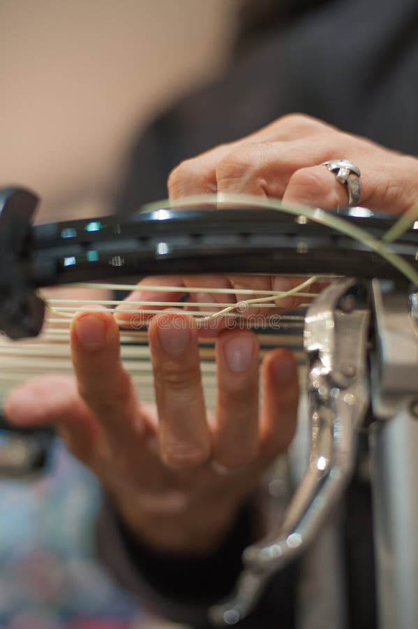Close Up of Tennis Stringer Hands Doing Racket Stringing Stock Photo ...