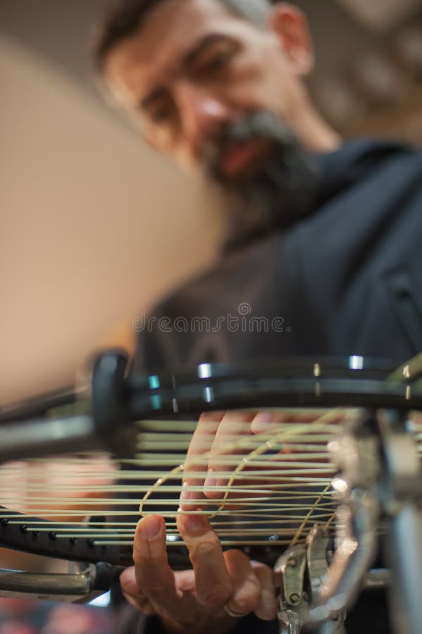 Close Up of Tennis Stringer Hands Doing Racket Stringing Stock Photo ...