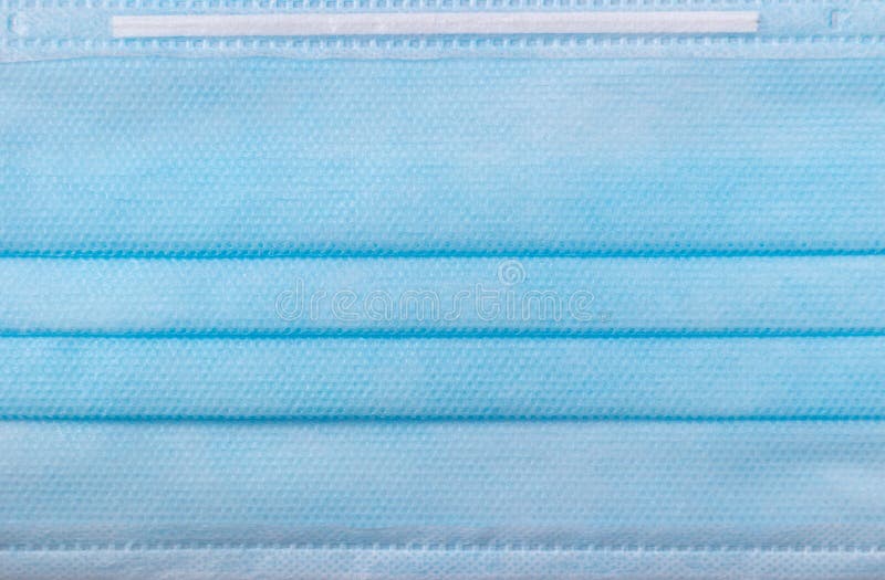 Texture of blue face mask stock photo. Image of detail - 194958422