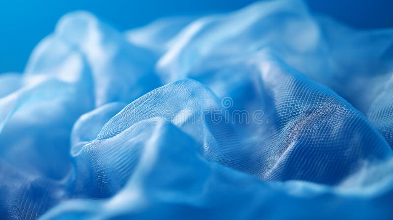 A Close-up of a Textured Blue Fabric with Soft Folds and a Delicate ...
