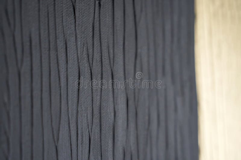 Close Up of Textured Dark Fabric with Wavy Pattern Next To Wooden ...