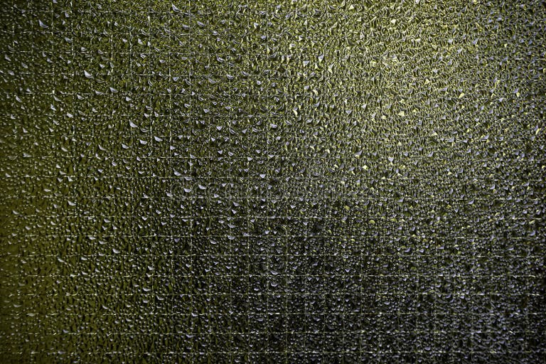 Close-up of Textured Green Glass with a Repeating Abstract Pattern ...