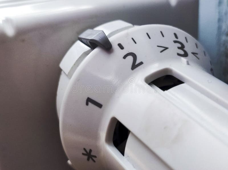 Close-up of a Thermostat Dial Showing Adjustable Temperature Settings ...