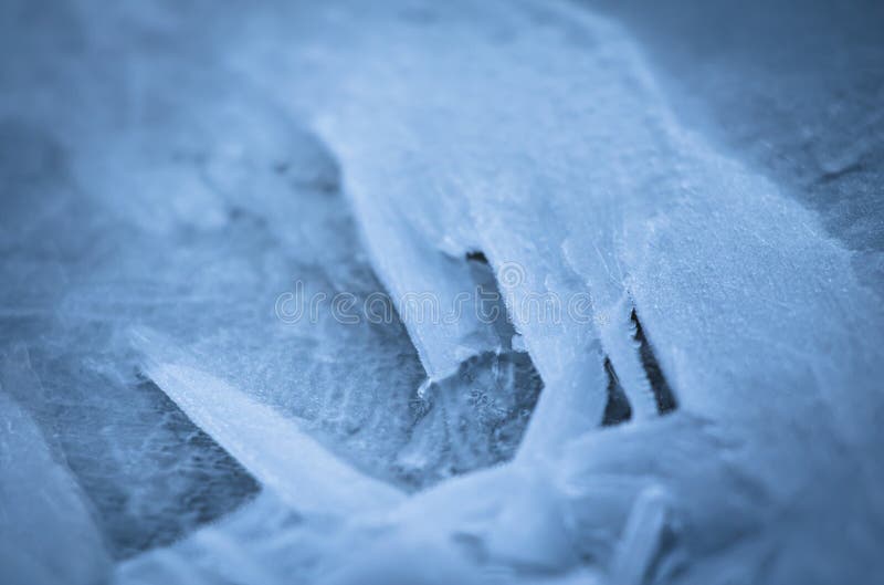Close Up on Thin Frozen Cracked Ice Plaques on Lake in Wintertime ...