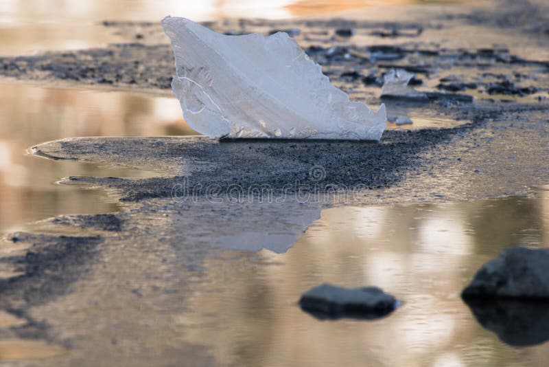 Close Up on Thin Frozen Ice Plaques on Lake in Wintertime, Background ...
