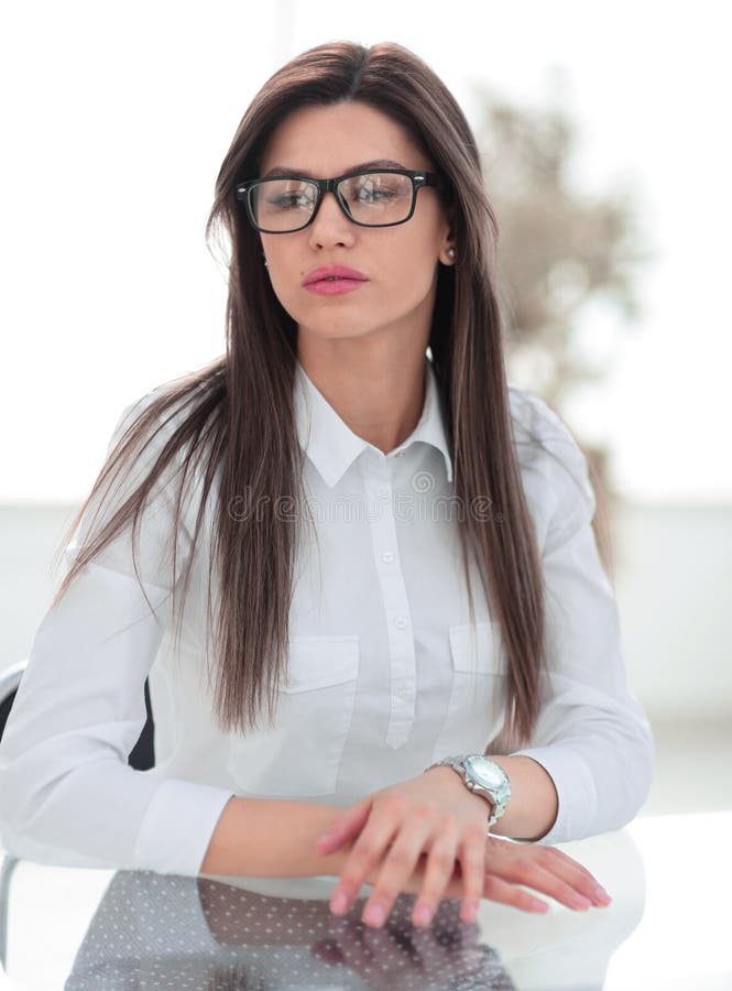 Close Up.thoughtful Business Woman Sitting at the Desk Stock Photo ... Close Up.thoughtful Business Woman Sitting at the Desk Stock Photo ...