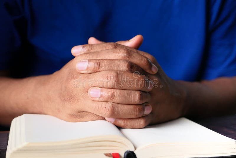 Close Up of Thoughtful Person`s Hand on a Open Book Stock Photo - Image ...