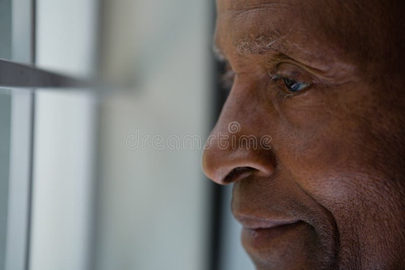 Close Up of Thoughtful Senior Man Looking Out through Window Stock ...