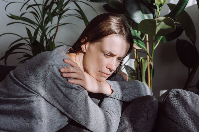 Close Up of Thoughtful Stressed Young Girl Sit on Couch Looking in ...