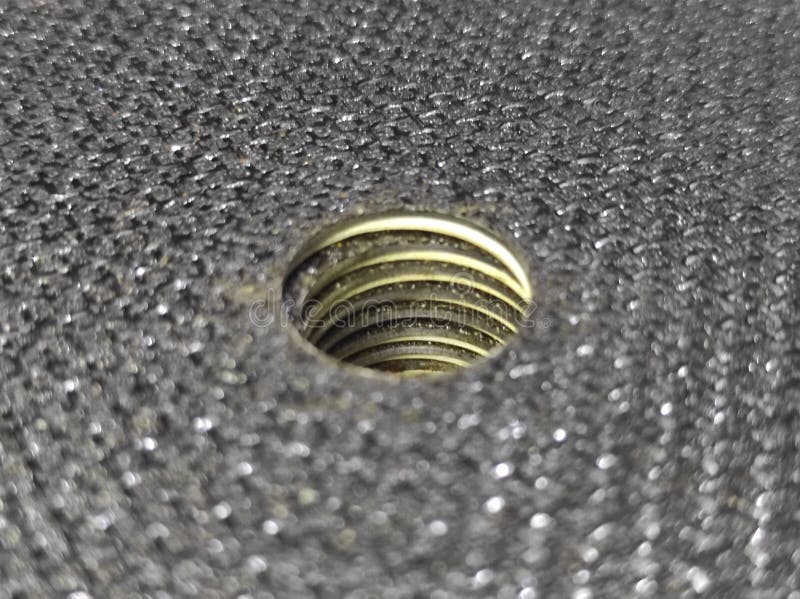 Close-up of a Threaded Hole in a Textured, Dark Surface Stock Image ...