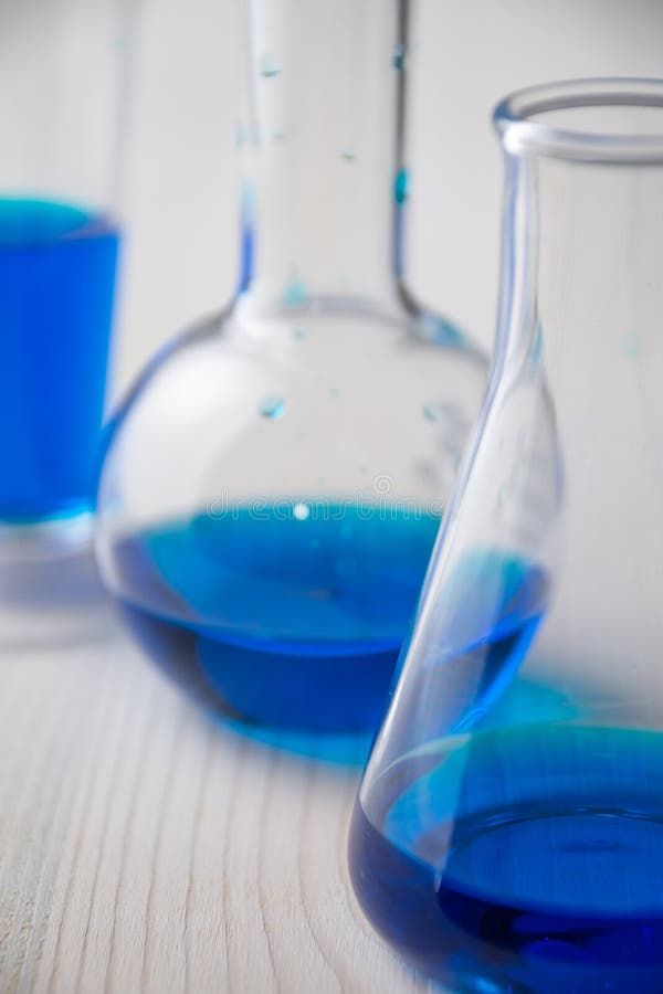 Close-up of Three Different Glass Test Tubes with Blue Liquid and ...