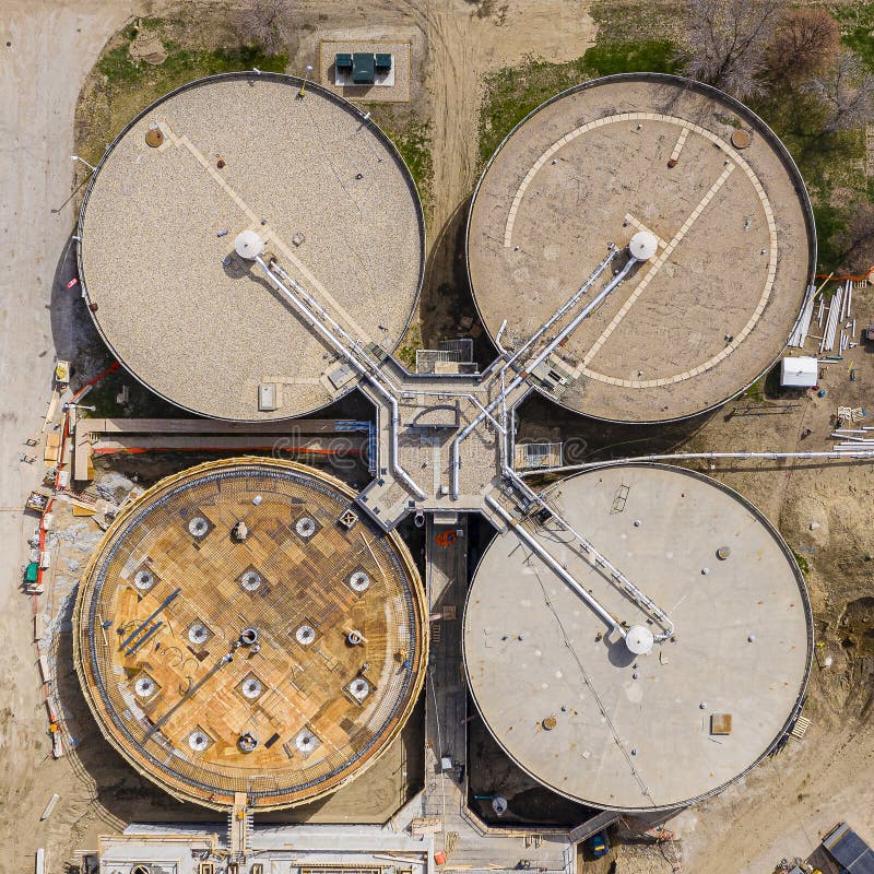 Close Up of Three Large Tanks with a Construction Site in the ...