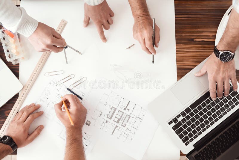 Three Men are Working on an Interesting Project. Teamwork. One of the ...