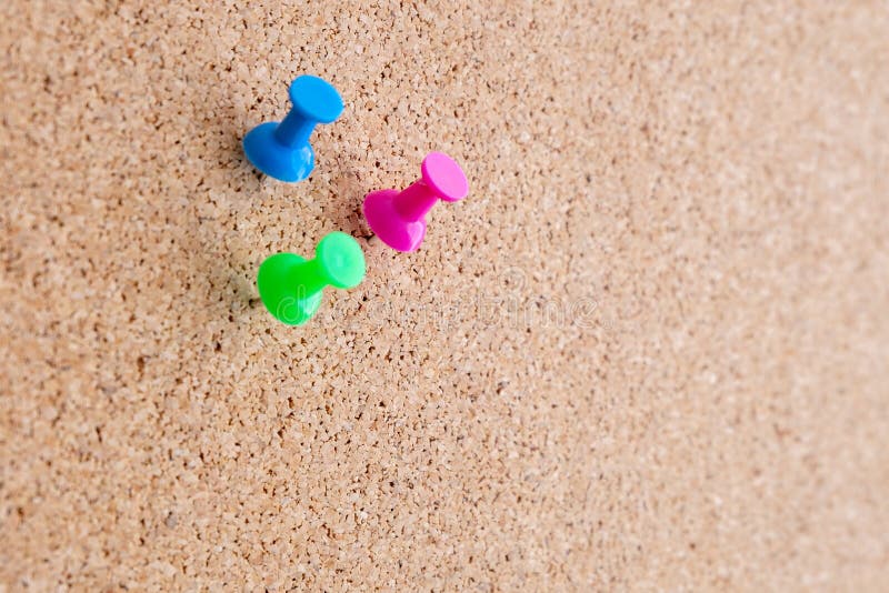 Close Up of Three Push Pins on a Cork Message Board Stock Photo - Image ...