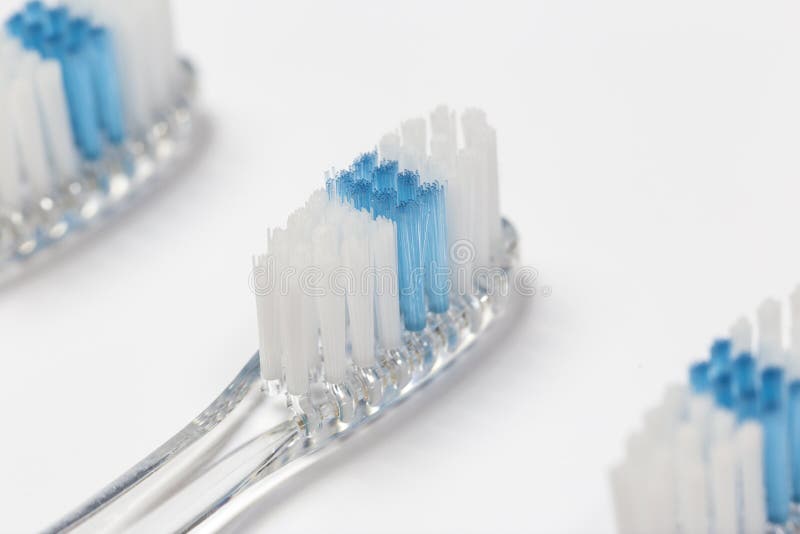 Close Up of Three Toothbrushes Stock Image - Image of brush, hygiene ...
