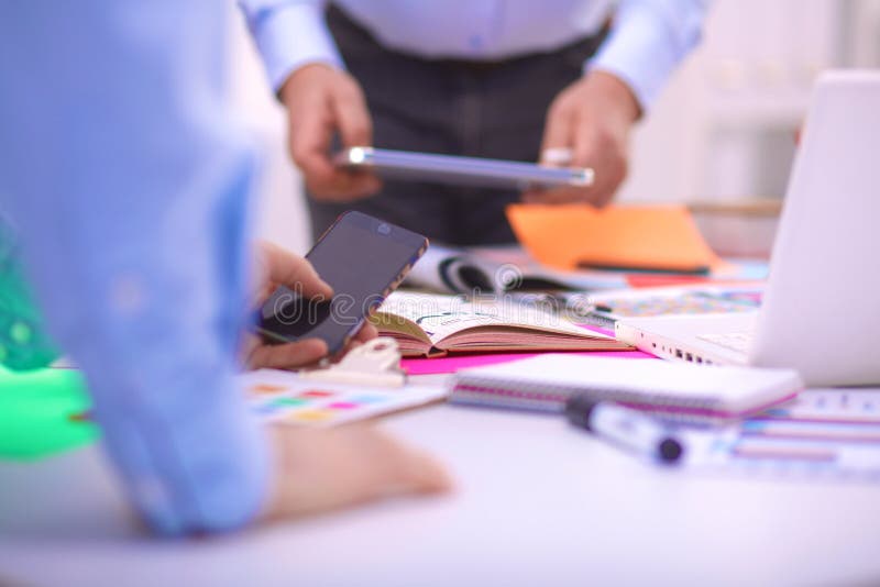 Close-up of Three Young Creative Designers Working on Project Together ...