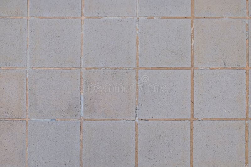 A Close Up of a Tile Floor with a White Wall Stock Photo - Image of ...