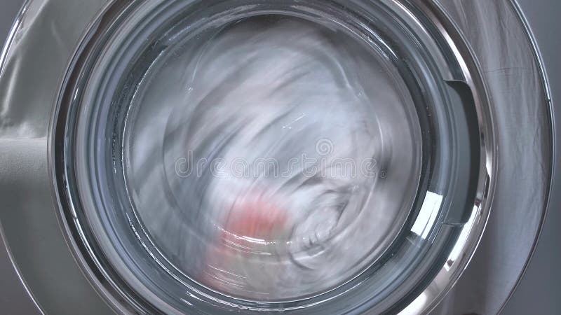 Close Up Timelapse of Washing Machine Spinning Fast Left and Right with ...