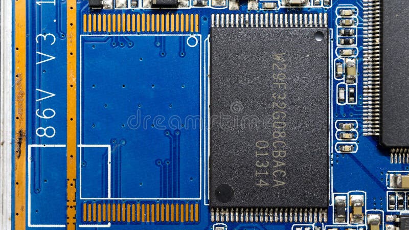 A Small Computer Chip on a Blue and White Piece of Electronics ...