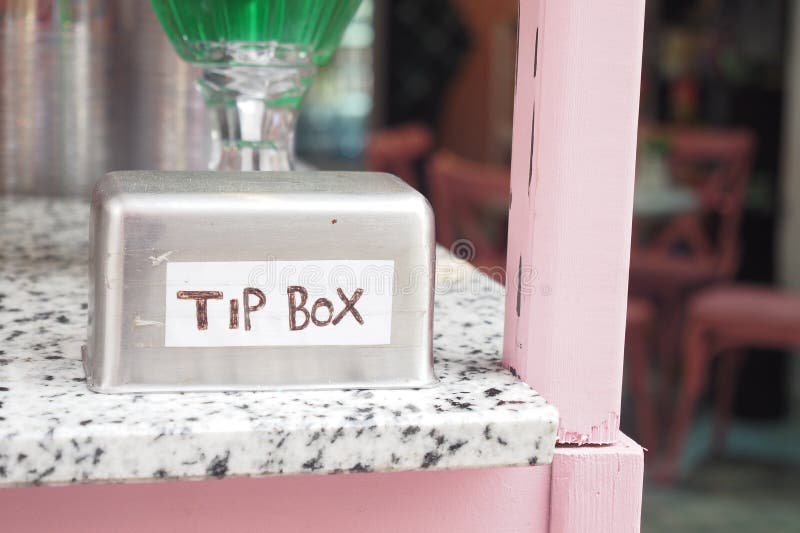Close Up of a Tips Box in a Cafe Stock Image - Image of yellow ...