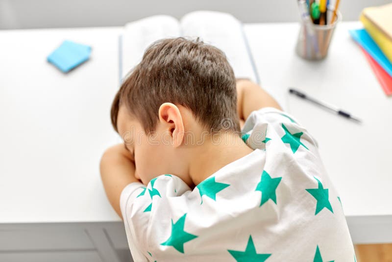 Close Up of Tired Boy Sleeping on Table at Home Stock Photo - Image of ...