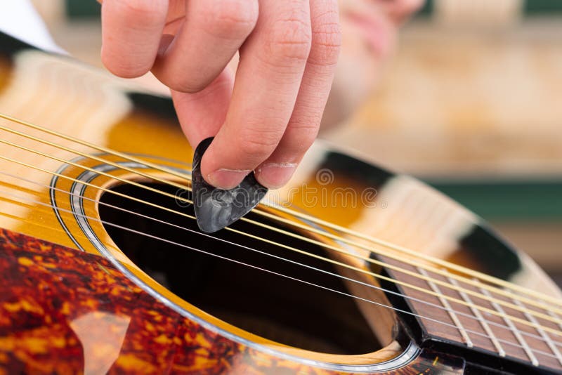 Close Up To a GuitarÂ´s Pick Over the Strings Stock Image - Image of ...