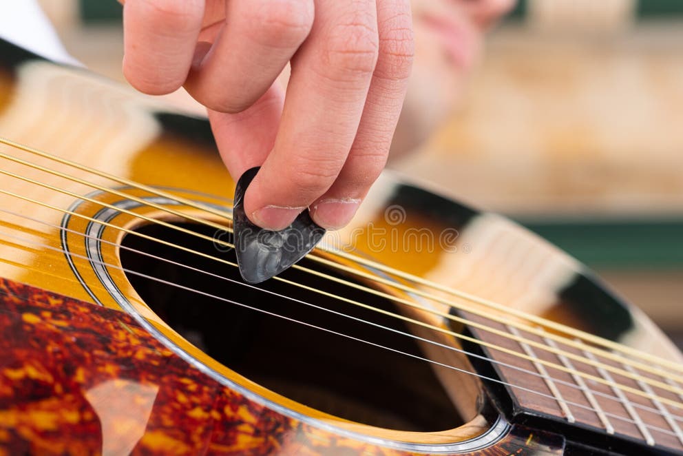 Close Up To a GuitarÂ´s Pick Over the Strings Stock Image - Image of ...