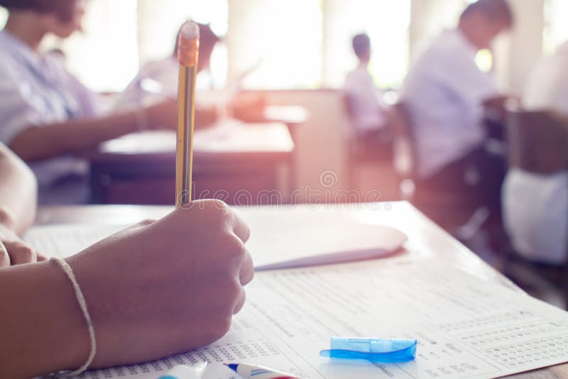 Close Up To Hand of Student is Taking Exam and Writing Answer in ...