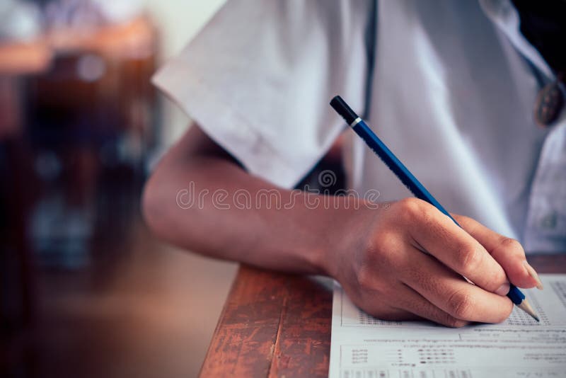 Close Up To Hand of Student is Taking Exam and Writing Answer in ...