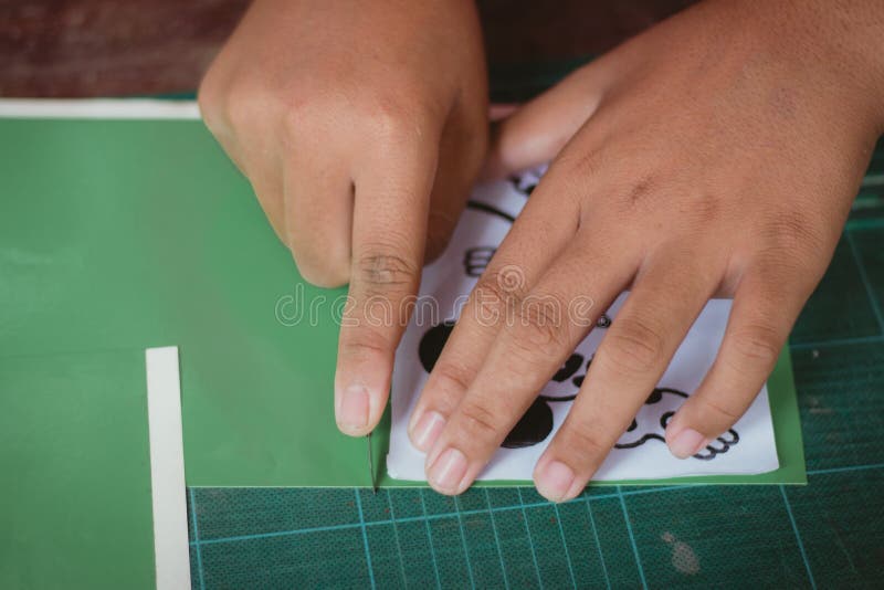 Close-up To Hands of Students are Cutting Prints and Stickers Stock ...