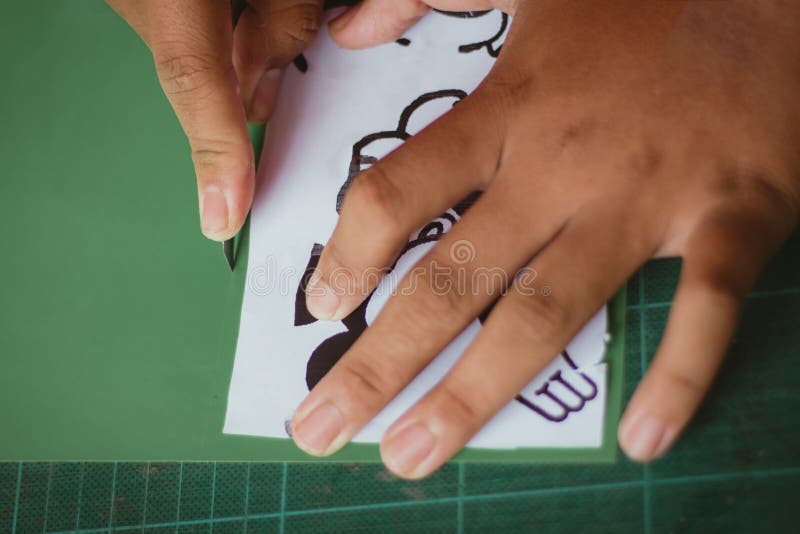 Close-up To Hands of Students are Cutting Prints and Stickers Stock ...