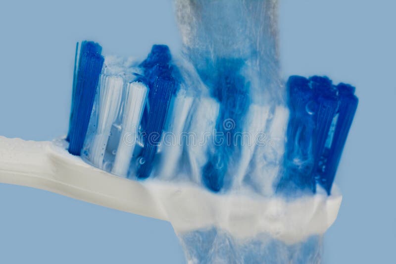 Cleaning of a toothbrush stock photo. Image of blue - 322823654
