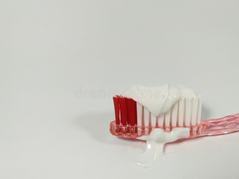 Close Up of a Toothbrush with Toothpaste on it, on a White Background ...