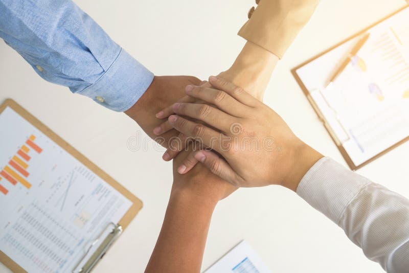 Close Up Top View of Business People Putting Their Hands Together ...