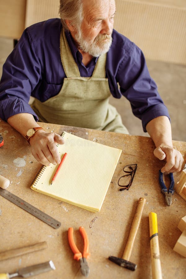 Close Up Top View Image of Old Builder with Pensive Look in Workshop ...