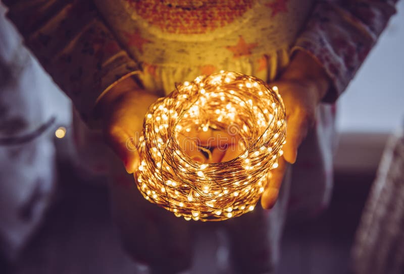 Close Up Top View of Person Holding Roll of Wire Micro LED String ...