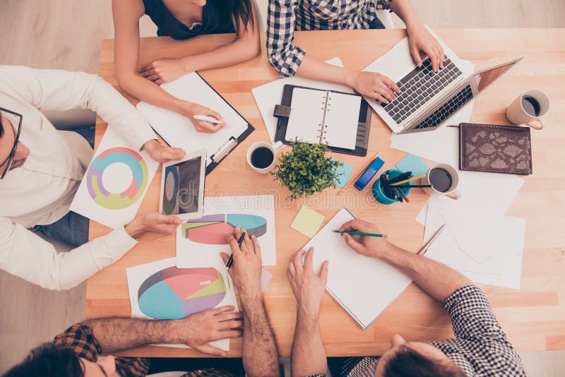 Close-up Top-view Photo of People Sitting at Conference Table and ...