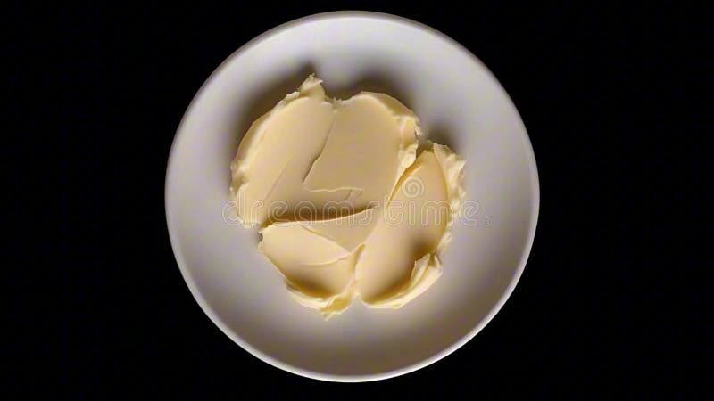 Rotating Butter Plate on Black Background, Close-up Top View, Smooth 4K ...
