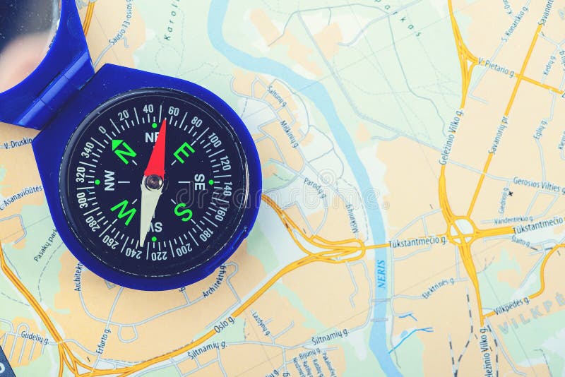 Close-up Top View of Road Map and Compass, Toned Image. Concept Stock ...