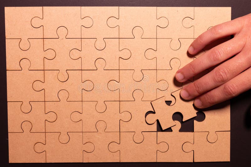 Close Up and Top View of Woman Putting the Last Piece into a Puzzle ...