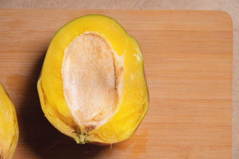 Close-up and Top View of the Yellow Pulp of Half a Cut Mango on the ...