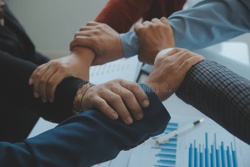 Close Up Top View of Young Business People Putting Their Hands Together ...