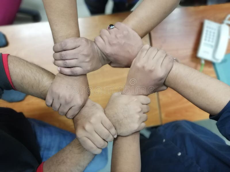 Close Up Top View of Young People Joining Their Hands Together Joining ...